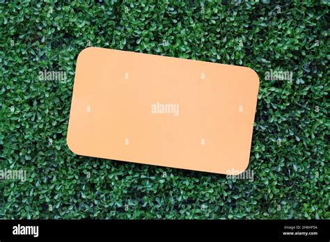 Top View Of Artificial Plastic Grass With Empty Signboard Green Fake