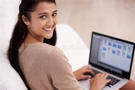 Shes An Internet Addict A Young Woman Sitting On Her Sofa Working On