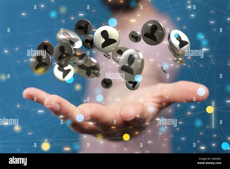 D Floating People Icons Over A Hand A Concept Of Networking HR Communication Stock Photo