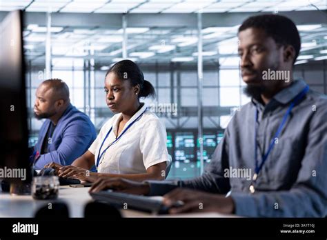 Team Of Programmers In Data Center Running System Diagnostic Tests On