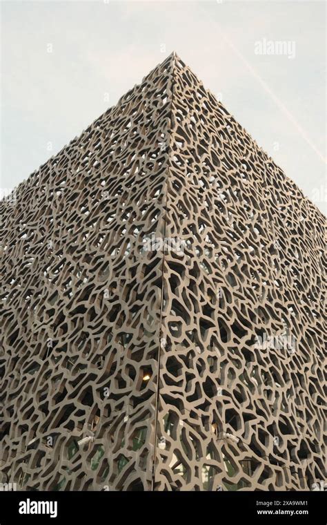 a massive triangular structure featuring modern geometric architecture