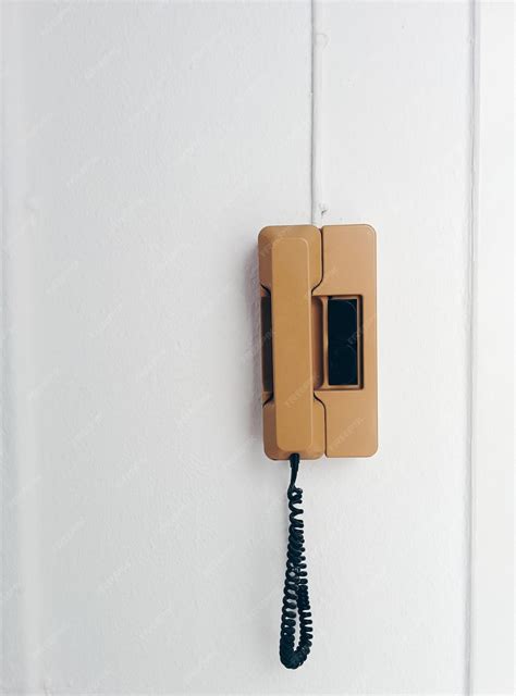 Premium Photo An Intercom Handset On A Wall