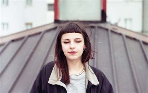 Download Italian Girl On Rooftop Wallpaper