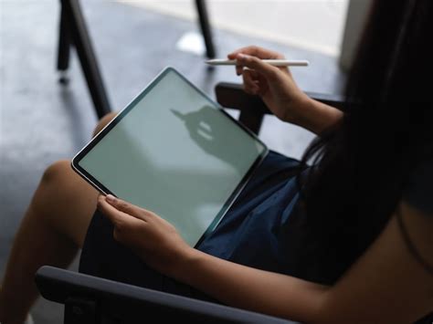 premium photo close up view of woman using mock up tablet while