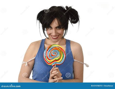 Donna Sexy Con Le Code Di Cavallo Che Morde Le Sue Labbra Che Tengono E
