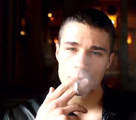 Handsome Young Cigarette Smoker Wearing Leather Jacket