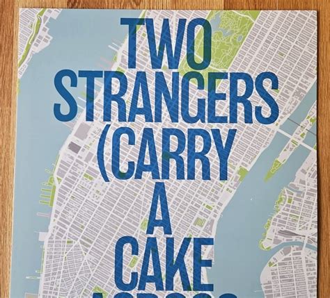 Two Strangers Carry A Cake Across New York Broadway Musical Window