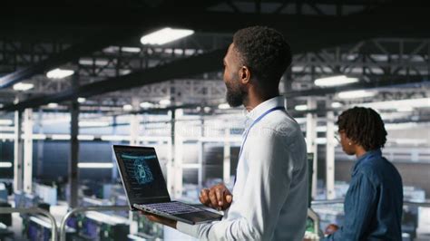 Programmer And Colleague In Data Center Reviewing Ai Llm Visualizations