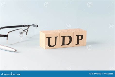 text udp user datagram protocol written on the wooden cubes on blue