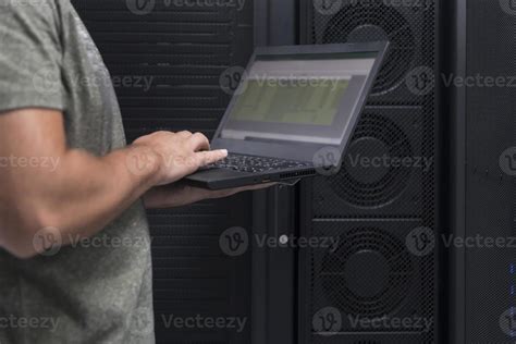 Data Center Engineer Using Laptop Computer Server Room Specialist Facility With Korean Male