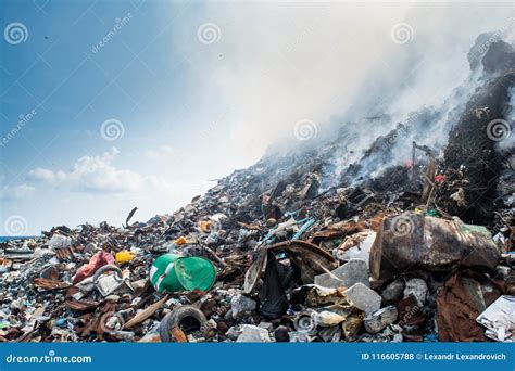 A Huge Garbage Dumpunloading Garbage Trucks At The Dump Royalty Free