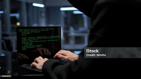 computer hacker typing code on keyboard late night working and