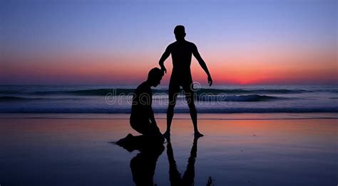 Silhouetted Figures On Beach At Sunset Stock Footage Video Of Water