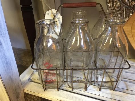 Antique Milk Bottles And Carrier Display