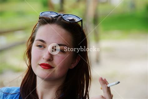 Stylish Woman Enjoying A Cigarette Royalty Free Stock Image Storyblocks