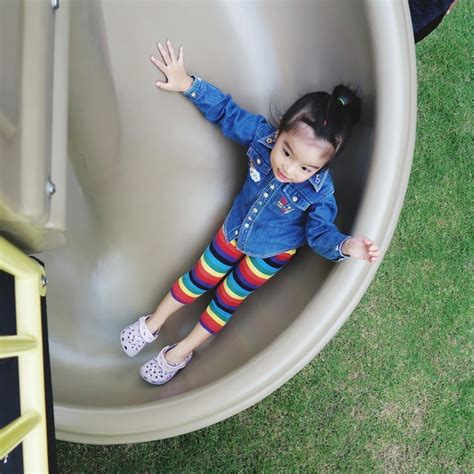 Premium Photo Cute Girl Playing In Playground