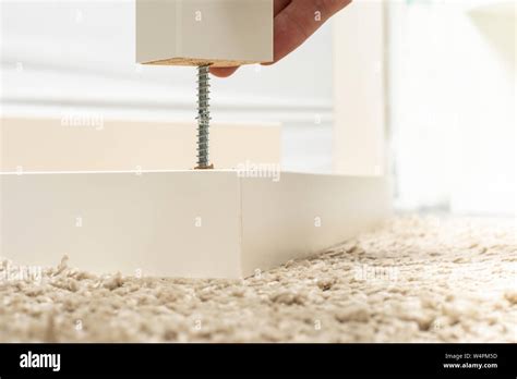 Assembling Furniture At Home Assembly Of The Table Modern Light Interior In Detail Stock