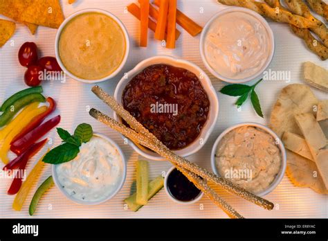 A Selection Of Party Dips With Bread Sticks Pita Bread And Other Crudites Stock Photo Alamy