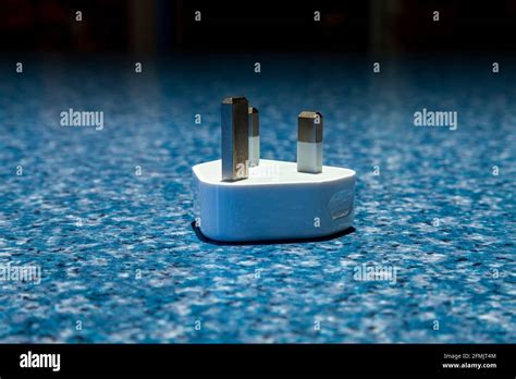 A Pin Plug Layed On It S Back With A Usb Connector For Charging
