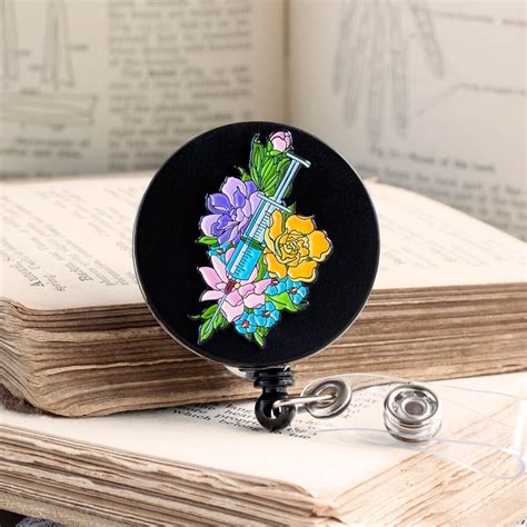 Syringe With Flowers Badge Reel Medical T Codex Anatomicus