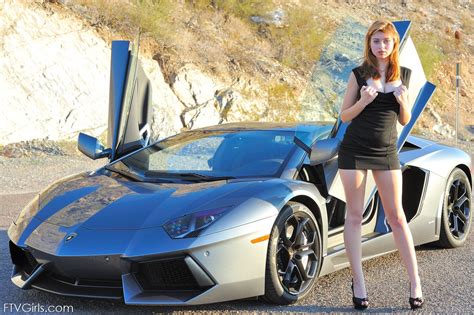 Redheaded Babe In A Skintight Dress Posing Next To A Fancy Sports Car
