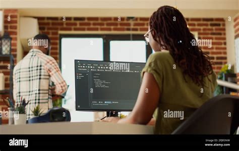 Female Programmer Using Code To Develop Online App Working With Html Script On Terminal Window