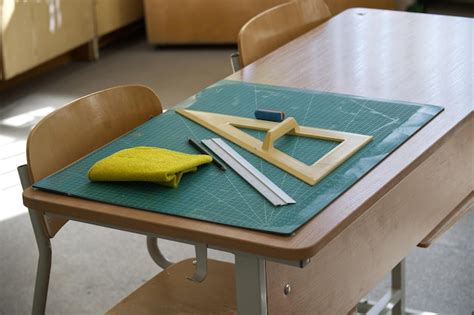 Classroom Desk With Math Tools Ruler And Eraser On A Cutting Mat