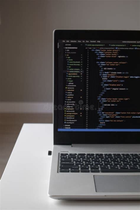 opened laptop with code on the screen on the table stock image image
