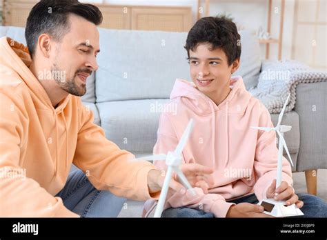 Teenage Boy And His Father With Wind Turbine Models At Home Stock Photo Alamy
