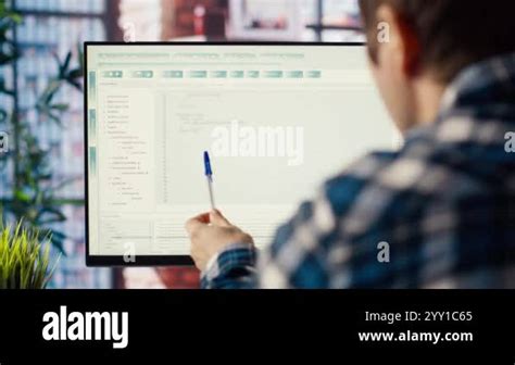 Programmer At Desk Typing Code Developing Software Programs Entering Commands Man In Home