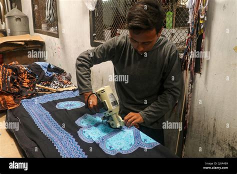 Electric Cutter Fabric Machine Cutting A Fabrics In An Workshop Man