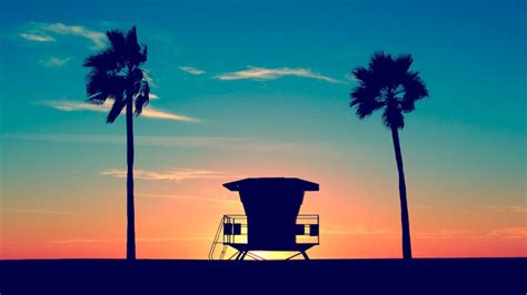 Lifeguard Tower With Palm Trees On A Beach At Sunset San Diego