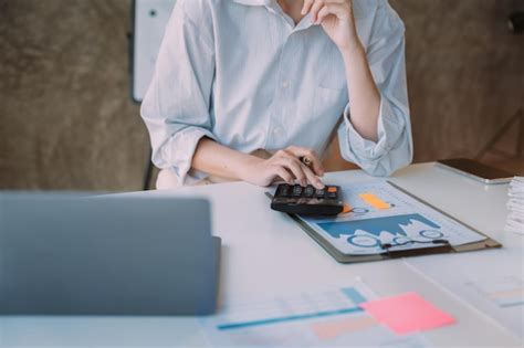 Premium Photo Business Woman Working On Desk Office With Using A Calculator To Calculate The