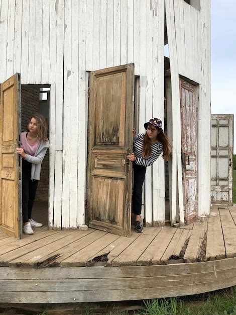 Premium Photo Women Peeking Through Doors