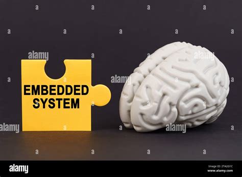 On A Black Surface There Is A Brain And A Yellow Puzzle With The