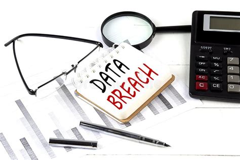 data breach text on notebook with calculator on diagram background