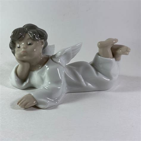 Lladro Angel Figurine In Glossy Porcelain Lying Down With Legs Crossed