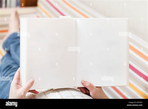 Man Read Book With Empty Pages In Living Room Stock Photo Alamy