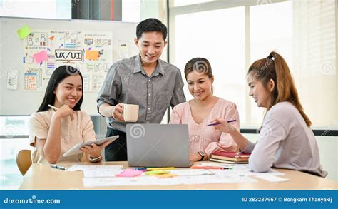 a team of professional asian tech developers planning and brainstorming