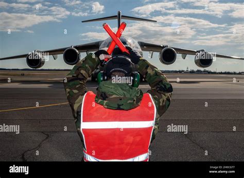 A Member Of The 436th Aircraft Maintenance Squadron Marshals A Kuwait