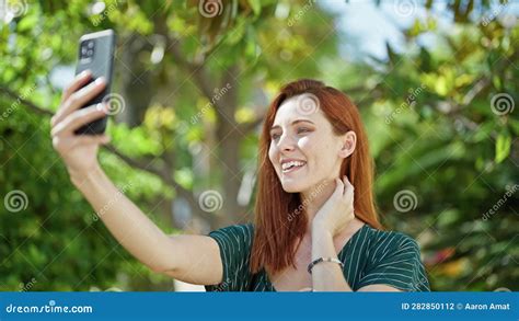 Young Redhead Woman Smiling Confident Making Selfie By The Smartphone