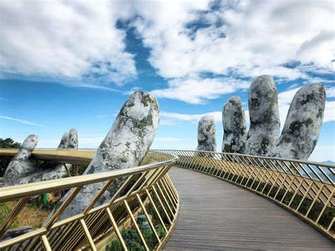Two Giant Hands Hold Up Golden Bridge In Vietnam