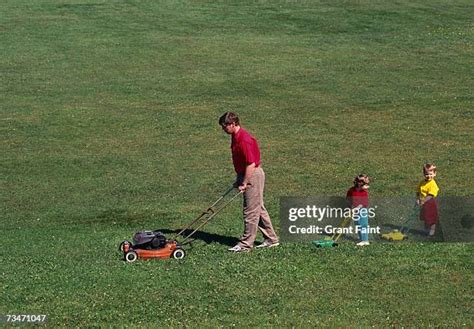 Dad Cutting Grass Photos And Premium High Res Pictures Getty Images