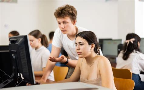 Teenagers Using Computer During Computer Science Lesson Stock Image