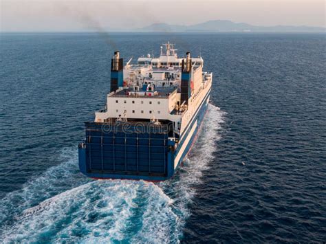Large Cargo Ship Sailing On Open Ocean Leaving A White Wake Editorial Photo Image Of Maritime