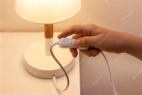 Premium Photo Switch Off Light Of Lamp Woman Hand Turn Off Lamp In