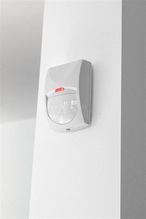 Safety System Motion Sensor Of The Security System On A White Wall