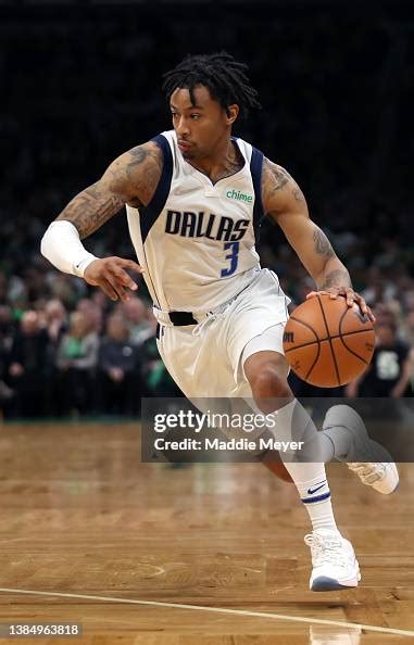 Trey Burke Of The Dallas Mavericks Dribbles Against The Boston News
