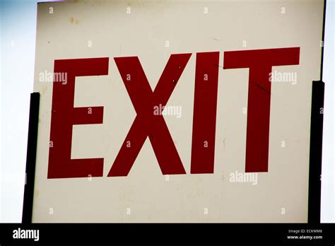 Large Exit Sign With Red Letters On White Stock Photo Alamy