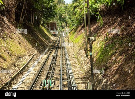 Penang Hill Railway Funicular Tracks Going Into Tunnel Tropical Green